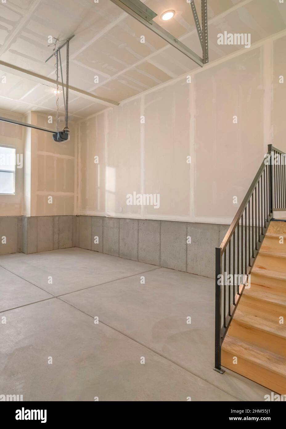 Vertical Empty garage interior with wooden stairs and windows Stock ...