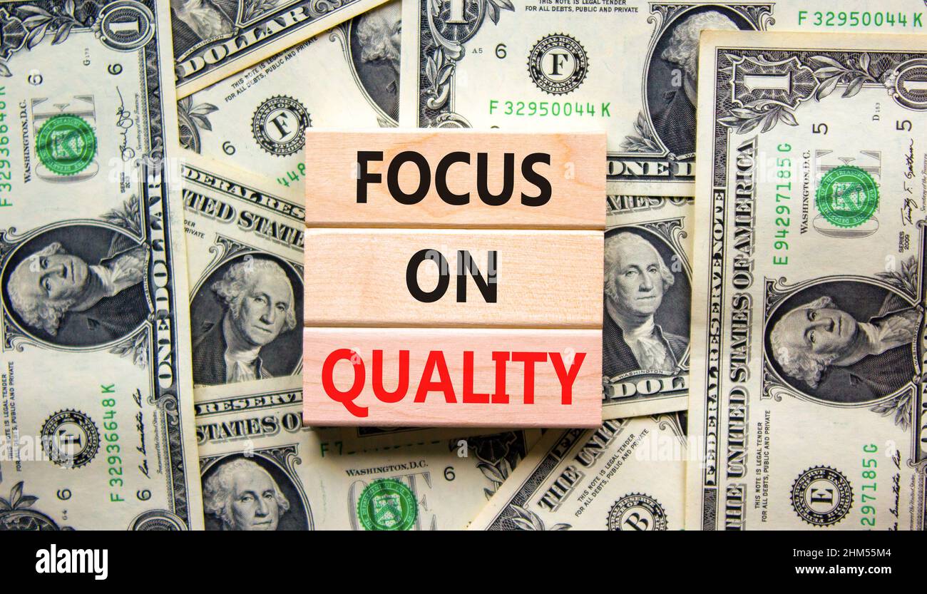 Focus on quality symbol. Concept words Focus on quality on blocks on ...