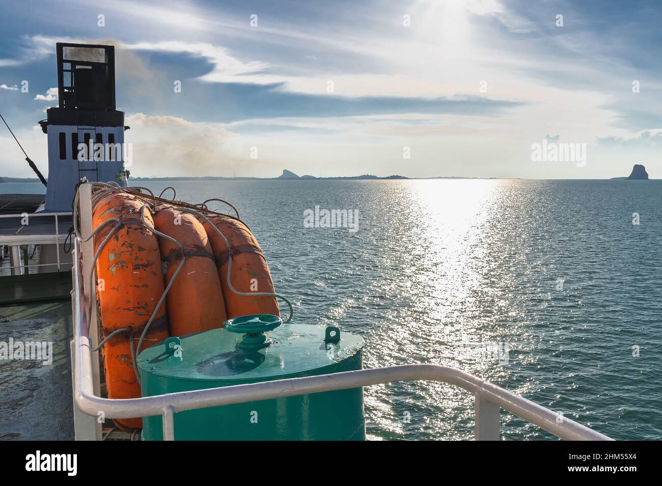 Orange inflatable lifeboats on ferry deck for emergencies and maritime ...