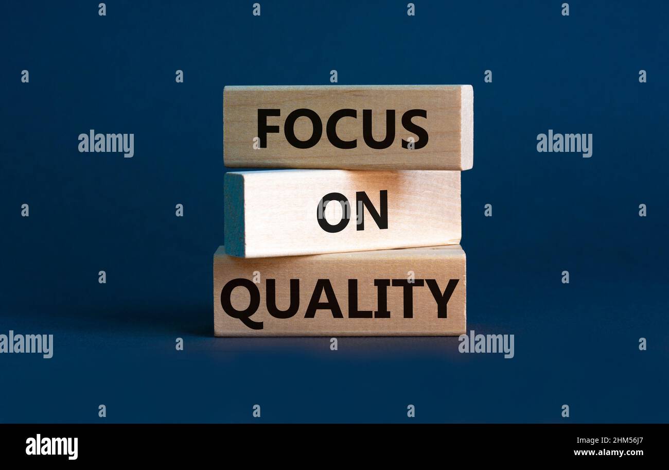 Focus on quality symbol. Concept words Focus on quality on blocks on ...
