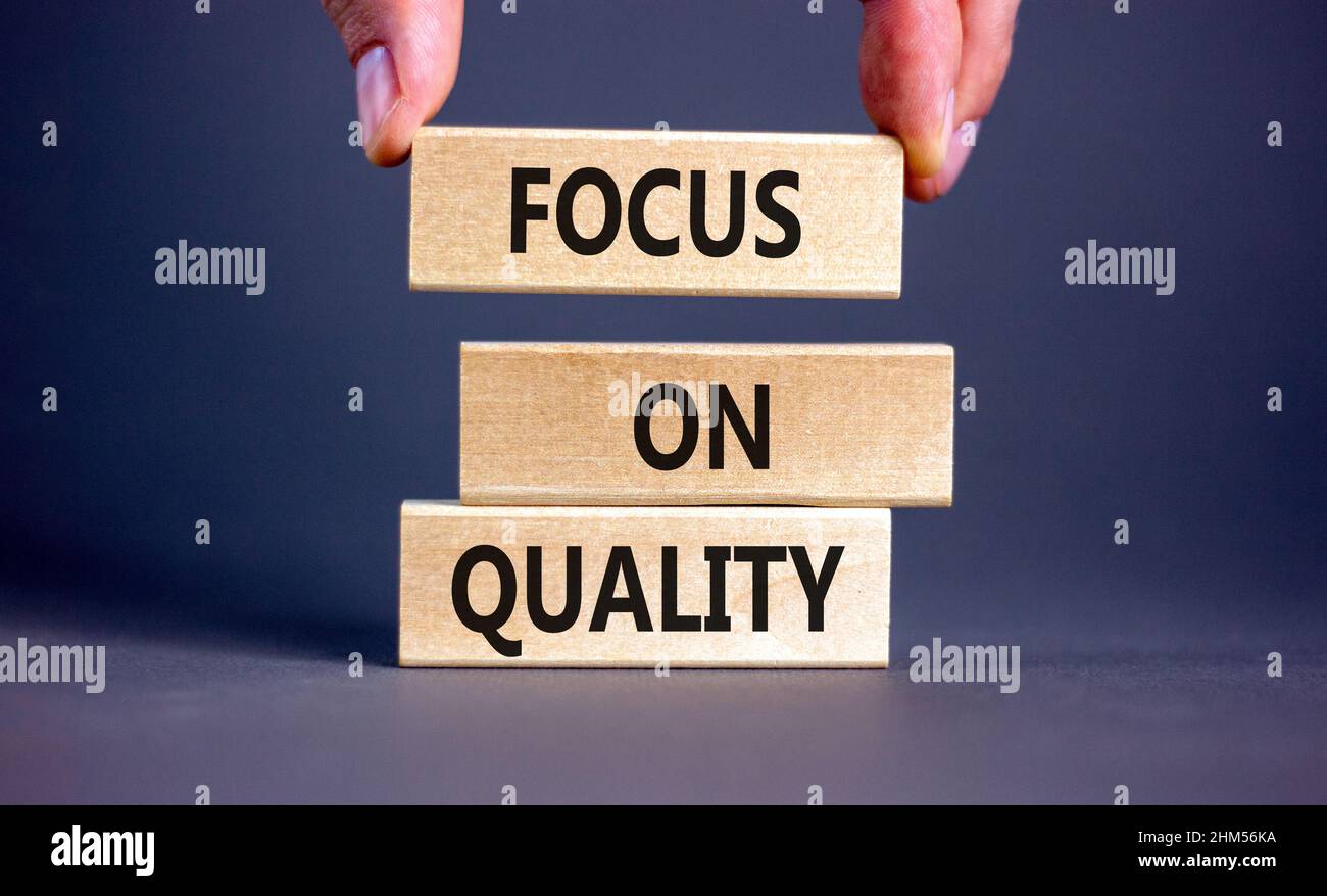 Focus on quality symbol. Concept words Focus on quality on blocks on ...