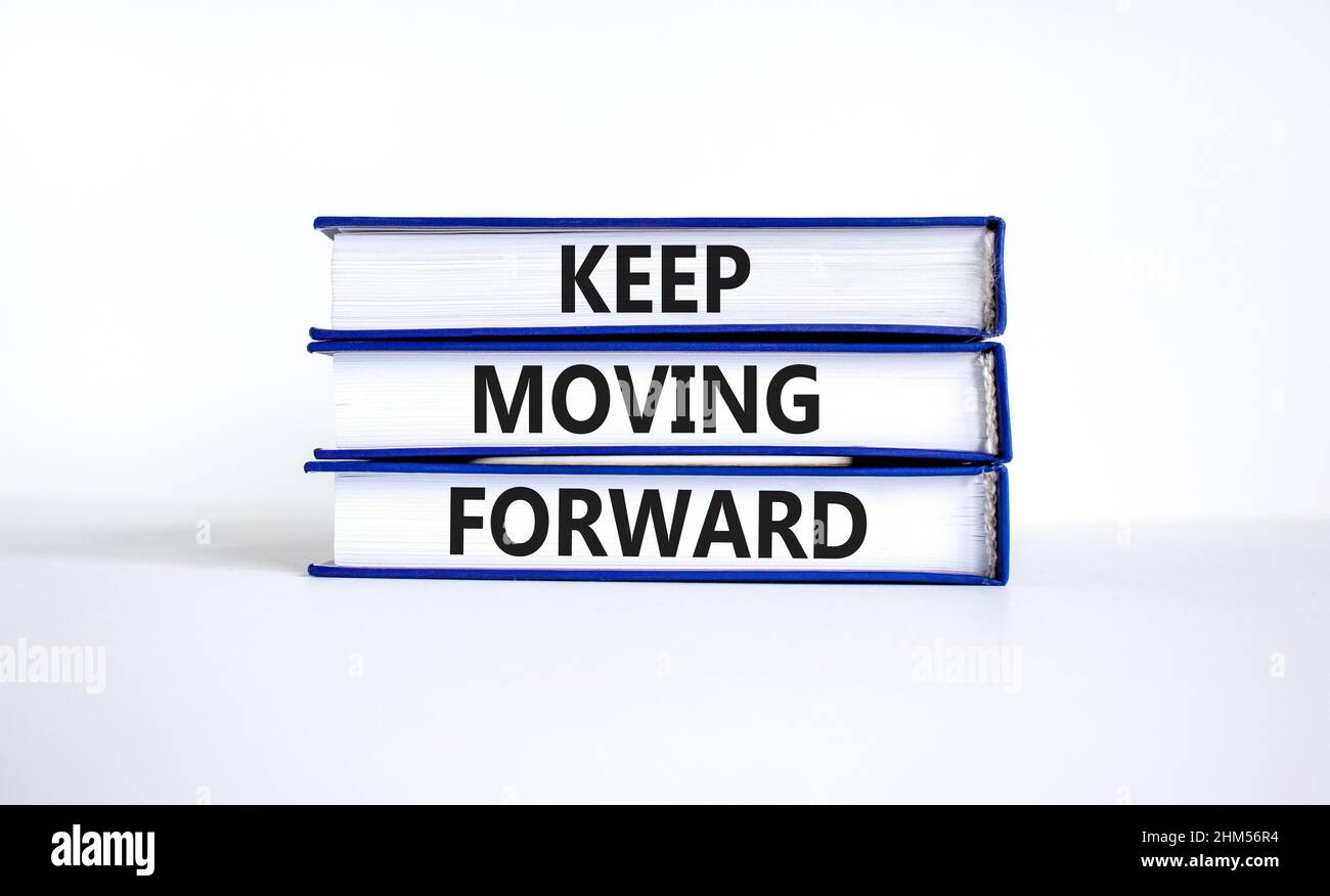 Keep moving forward symbol. Concept words Keep moving forward on books ...