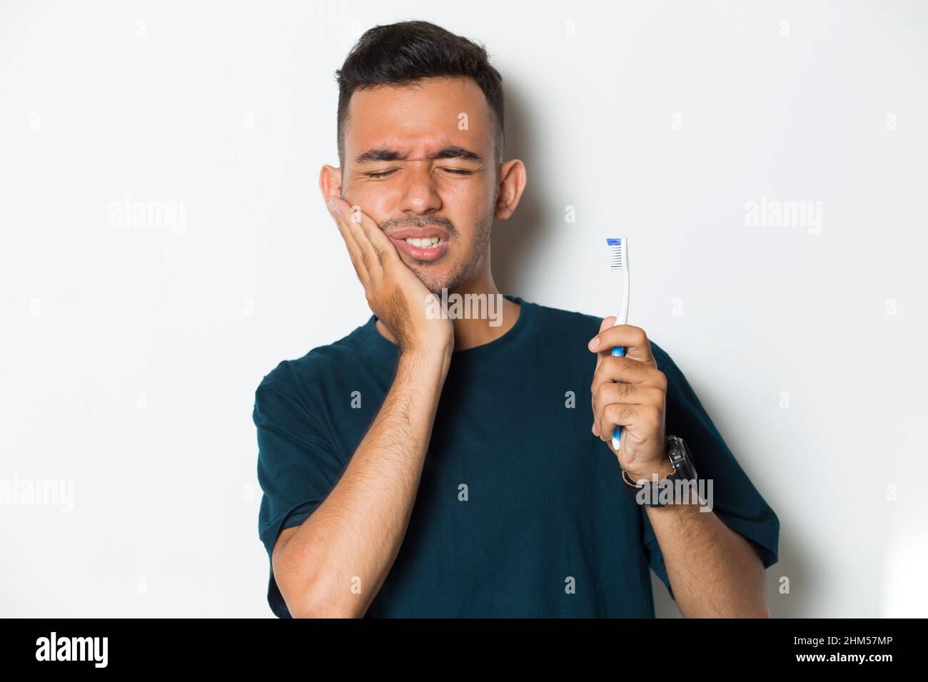 man with toothache; portrait of man suffering from toothache pain ...
