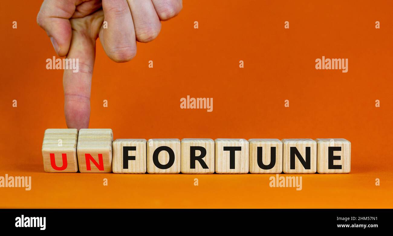 Fortune or unfortune symbol. Businessman turns wooden cubes and changes ...