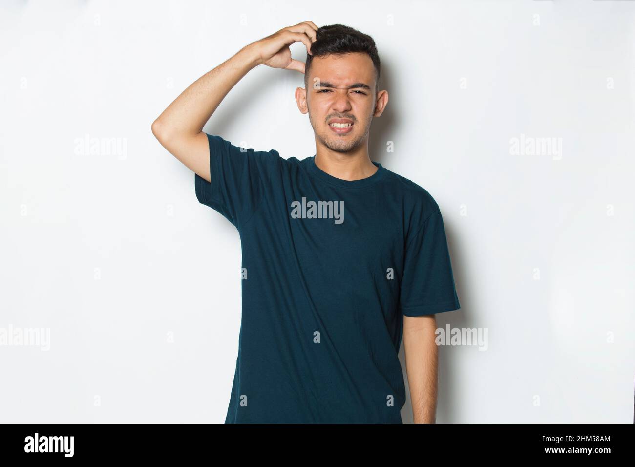 Man back view scratching head hi-res stock photography and images - Alamy