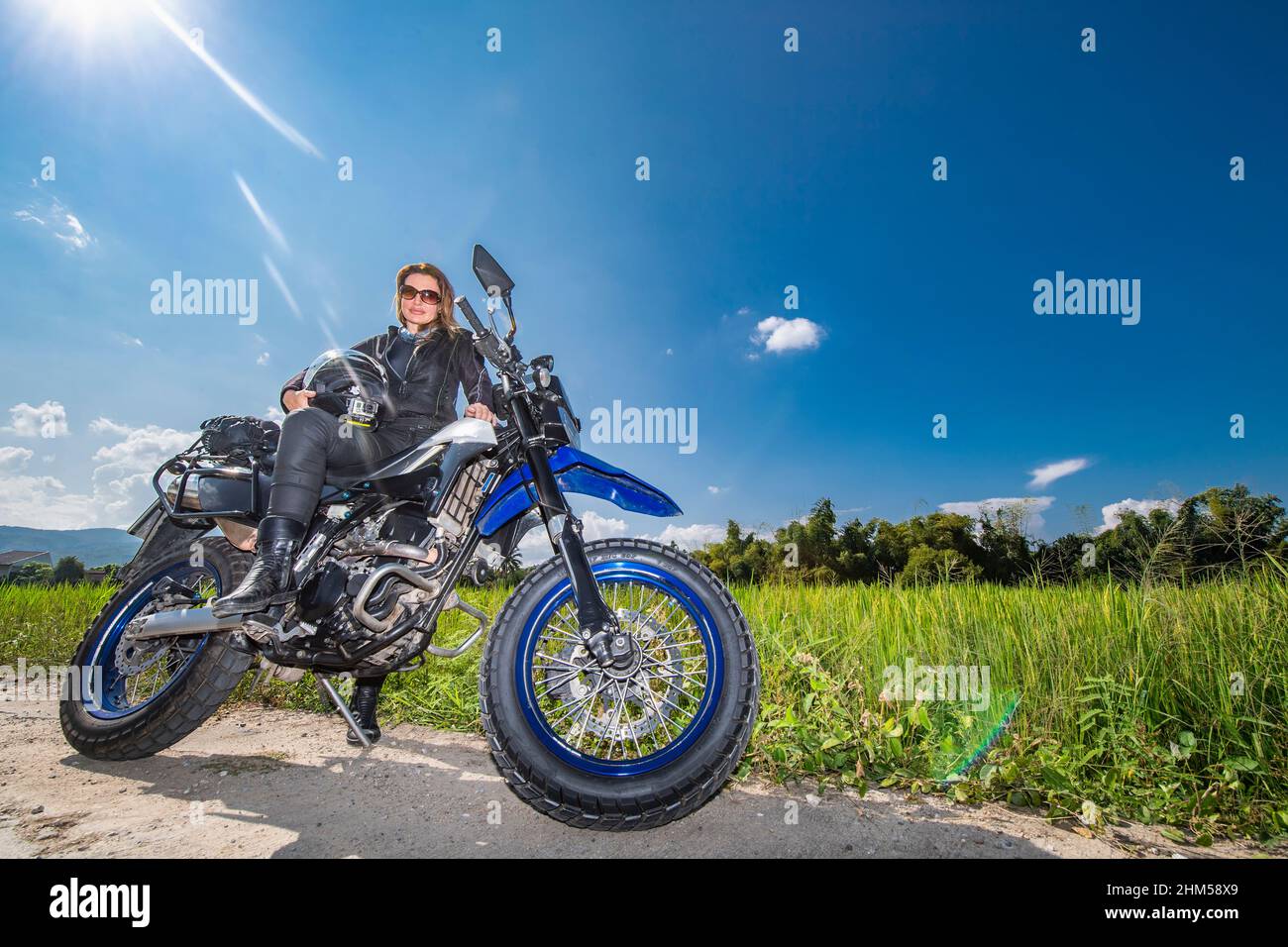 Woman posing on motorcycle hi-res stock photography and images - Alamy