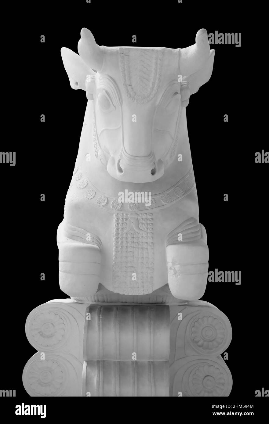 Stone statue. Bull isolated on a black background with clipping path ...
