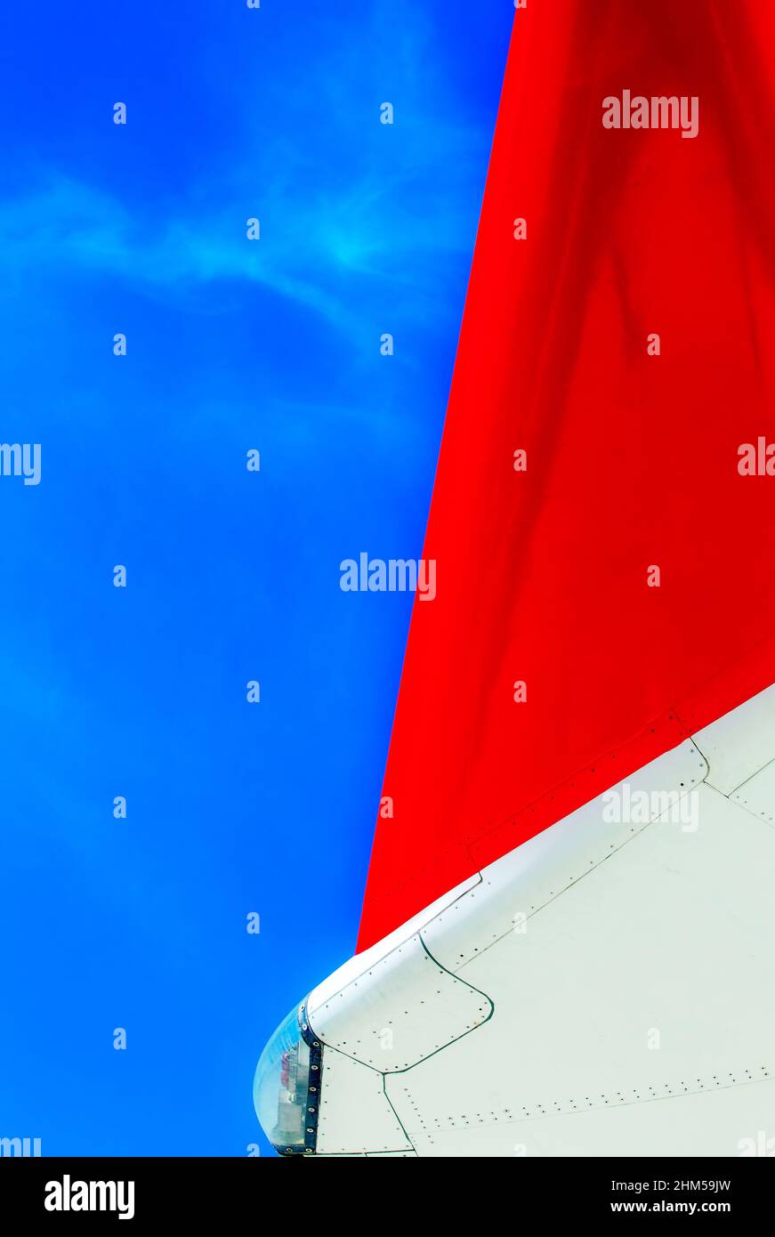 Red Aircraft Aileron on a Blue Sky Stock Photo - Alamy
