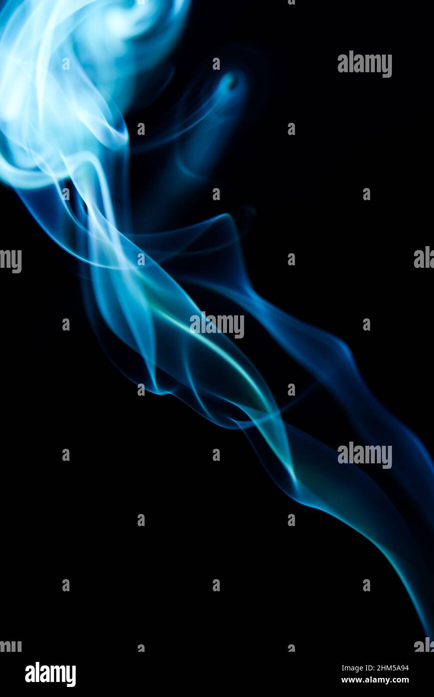 beautiful blue puffs from cigarette smoke Stock Photo - Alamy