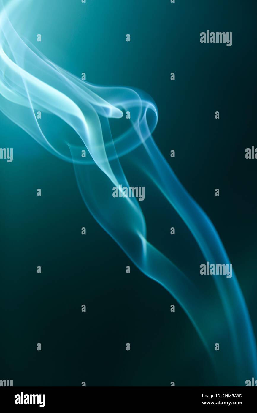 beautiful blue puffs from cigarette smoke Stock Photo - Alamy