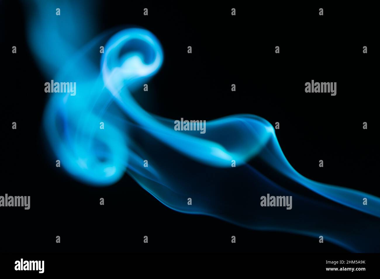 beautiful blue puffs from cigarette smoke Stock Photo - Alamy