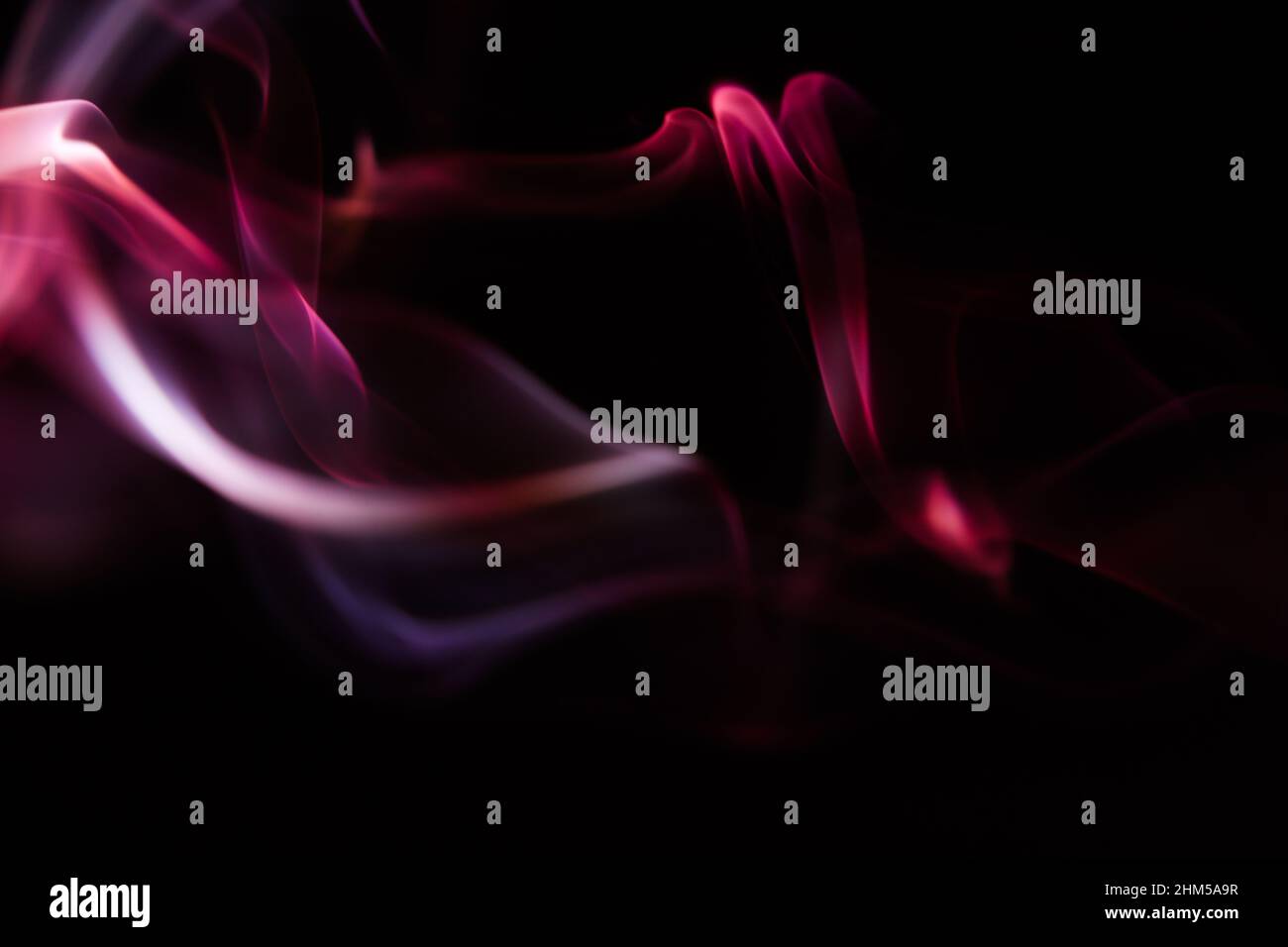 Beautiful red and pink puffs of smoke Stock Photo - Alamy