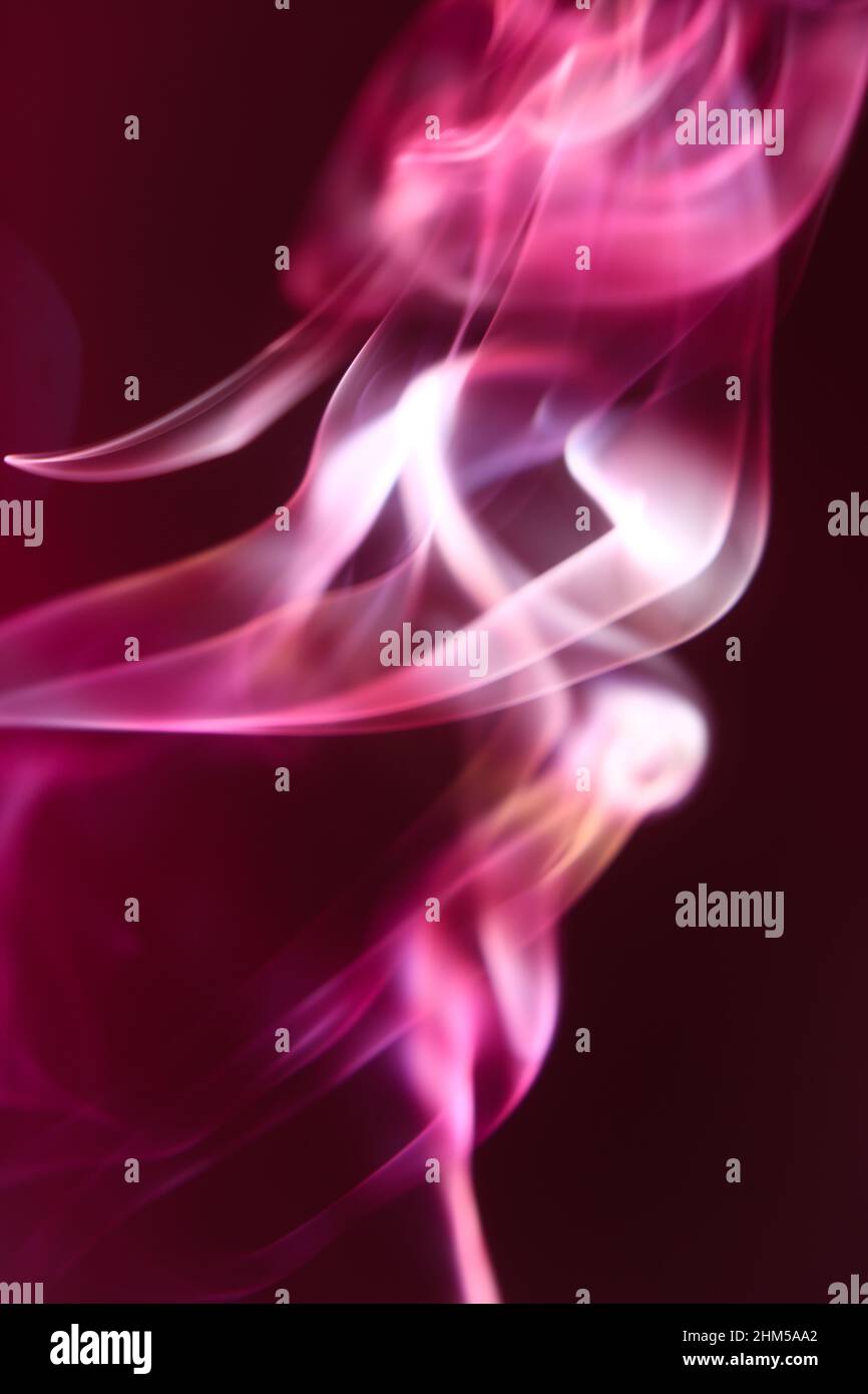 Beautiful red and pink puffs of smoke Stock Photo - Alamy