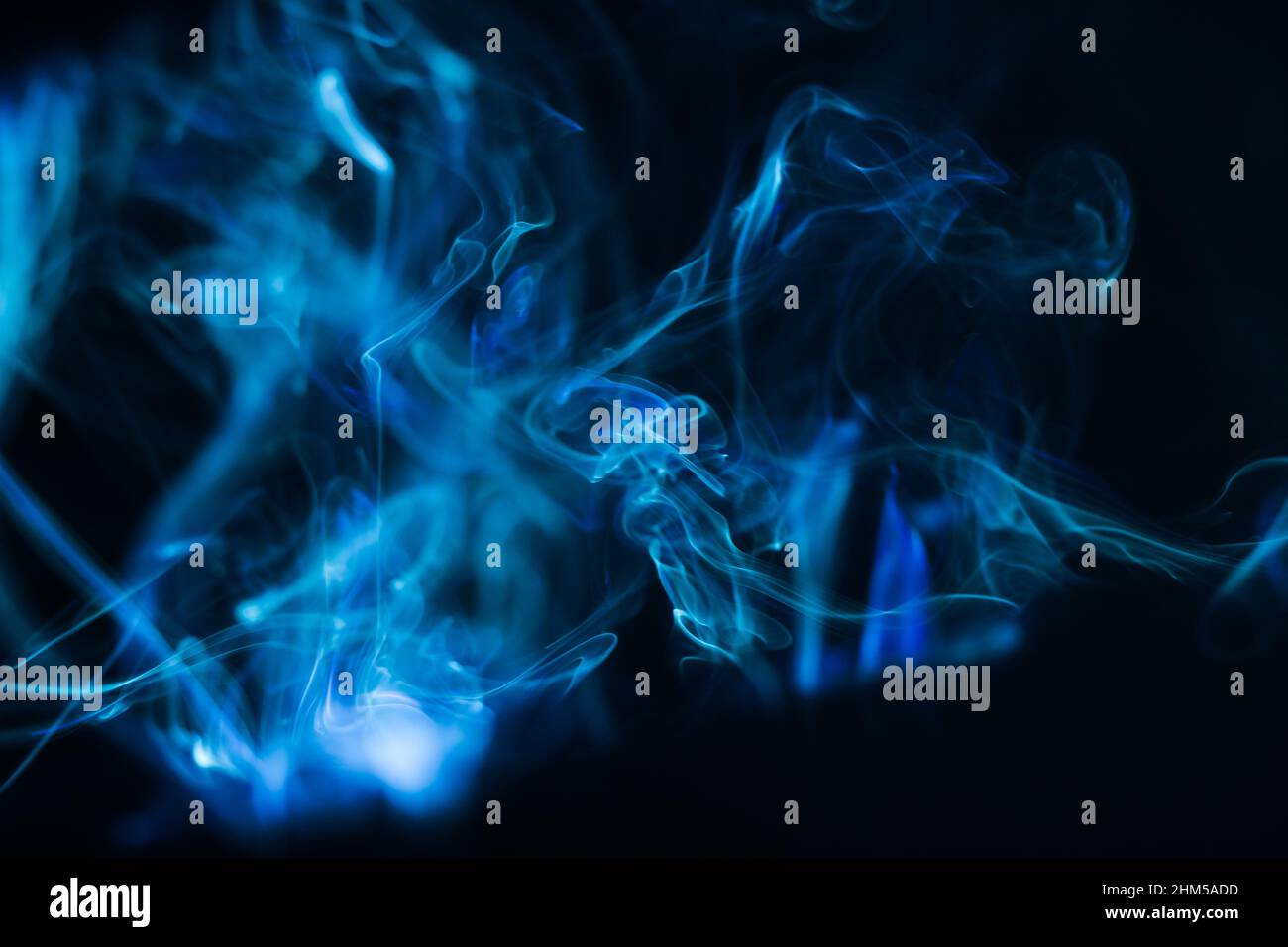 beautiful blue puffs from cigarette smoke Stock Photo - Alamy