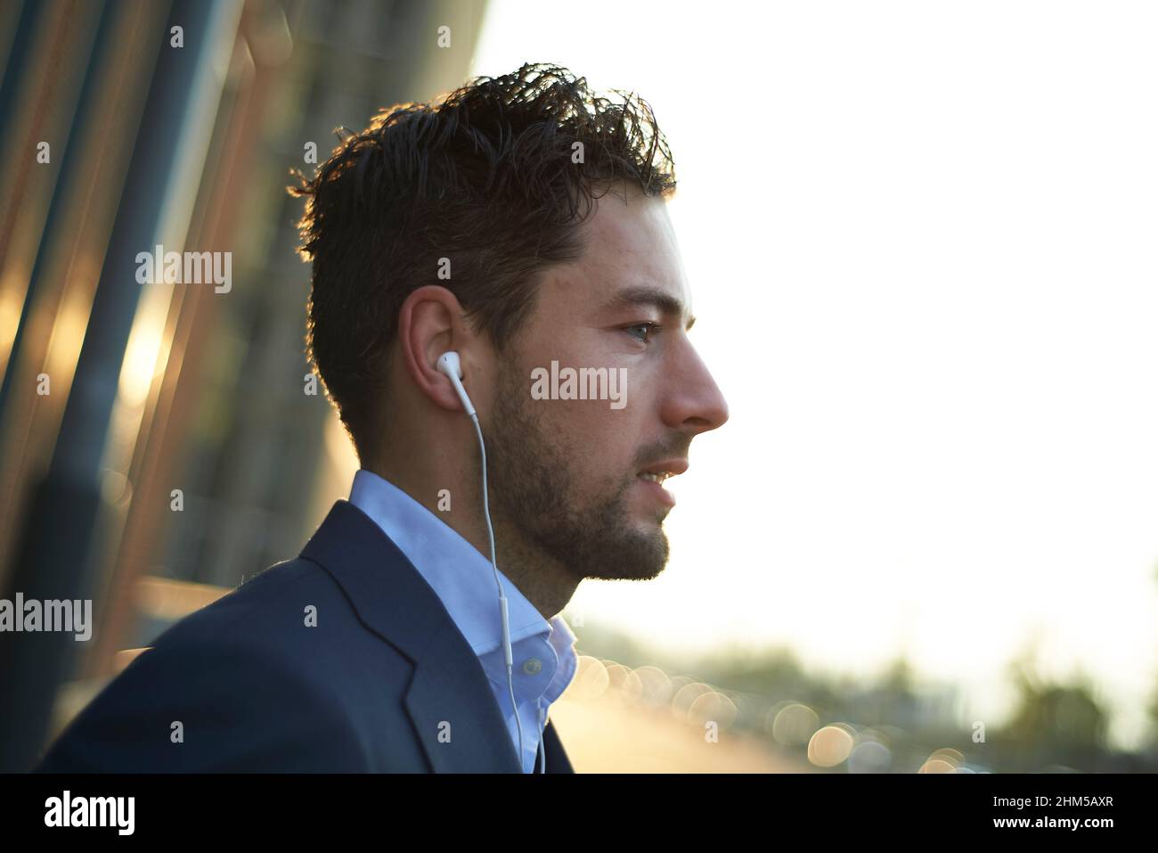Side profile of a business man wearing a suit Stock Photo - Alamy