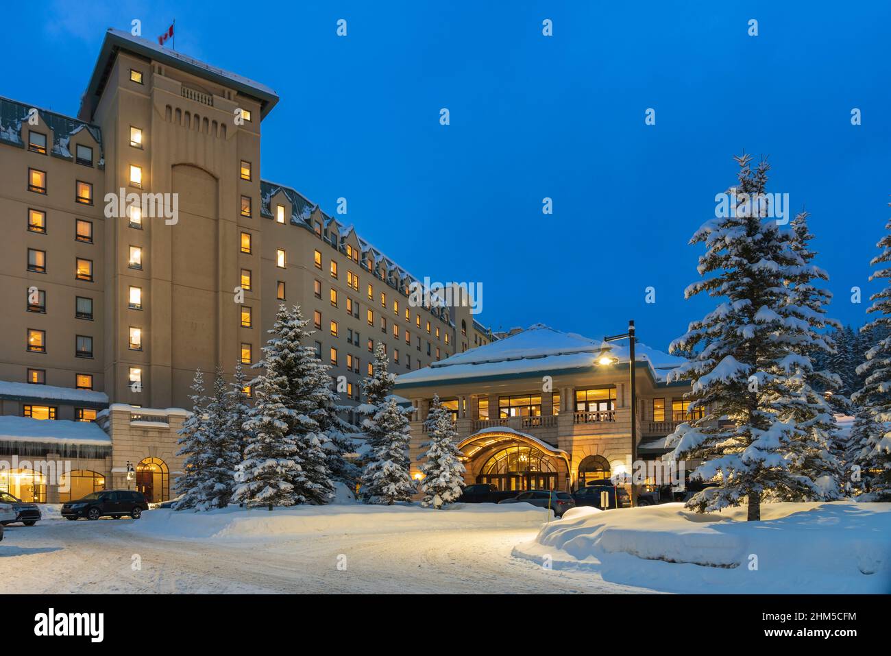 A view of a partially frozen Lake Louise in winter, Banff National Park ...
