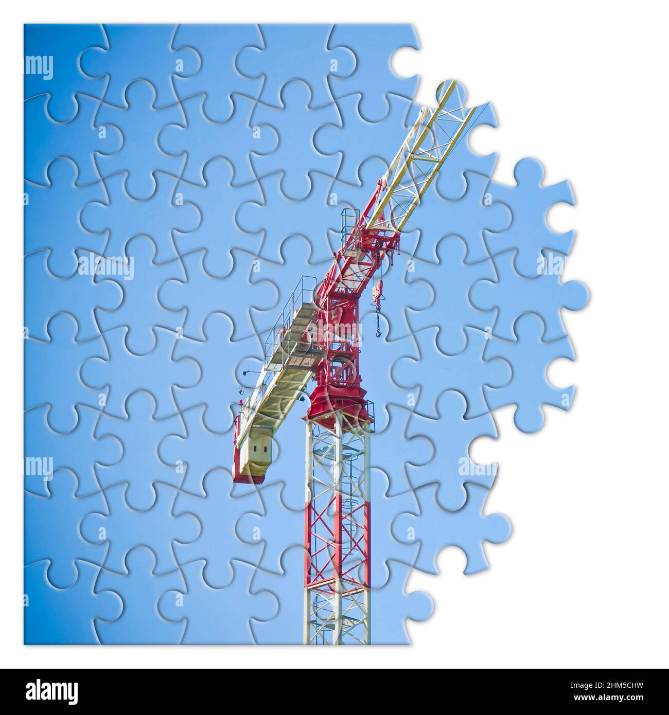 Tower crane against a blue background in puzzle shape - concept image ...
