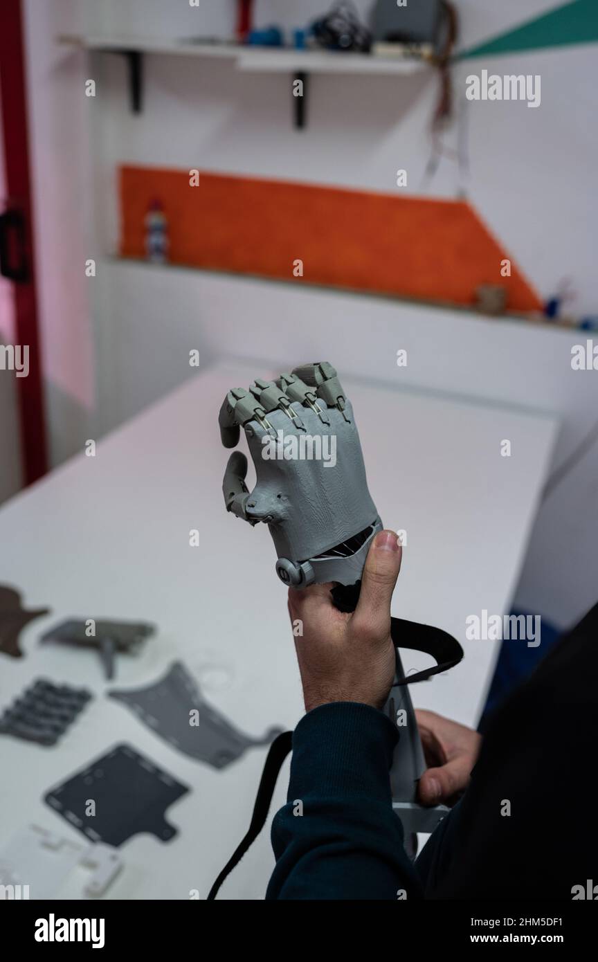 Man mounts a 3D Printed plastic arm prosthesis at Zaragoza MarketSpace ...