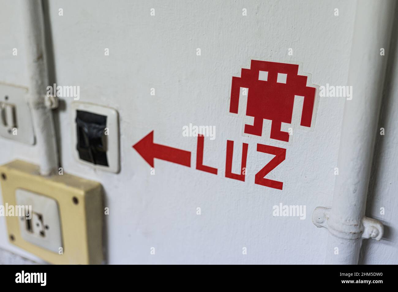Alien sticker indicates light interruptor Stock Photo - Alamy