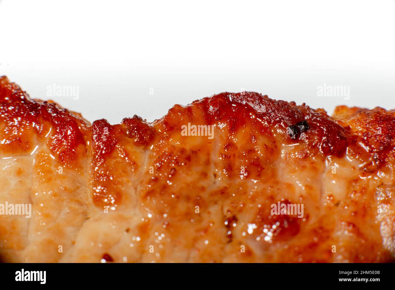 Texture of fried meat close up. A fatty piece of pork at a large ...