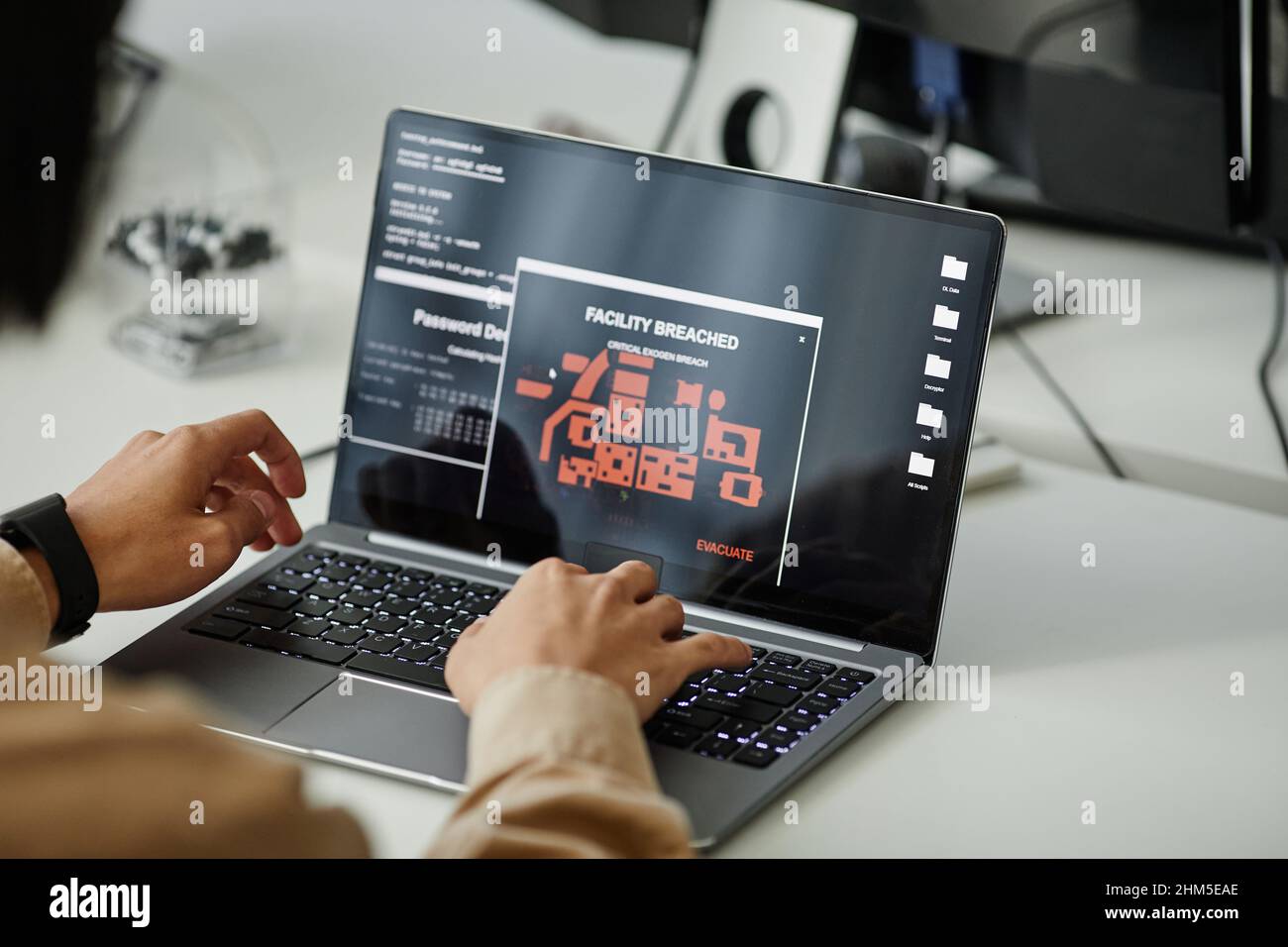 Hands of contemporary programmer pressing keys of laptop keyboard while ...
