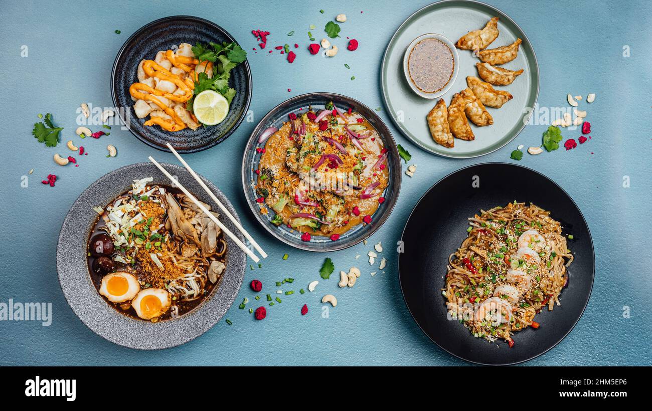 Dinner table with delicious meals Stock Photo - Alamy