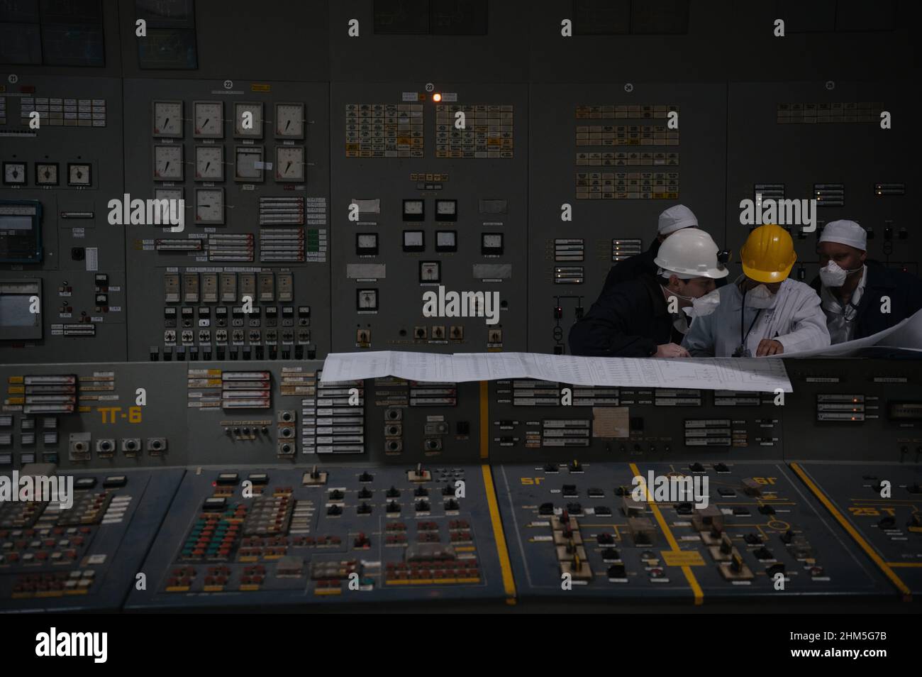 Workers decipher complex diagrams in control room 3 at the Chernobyl ...