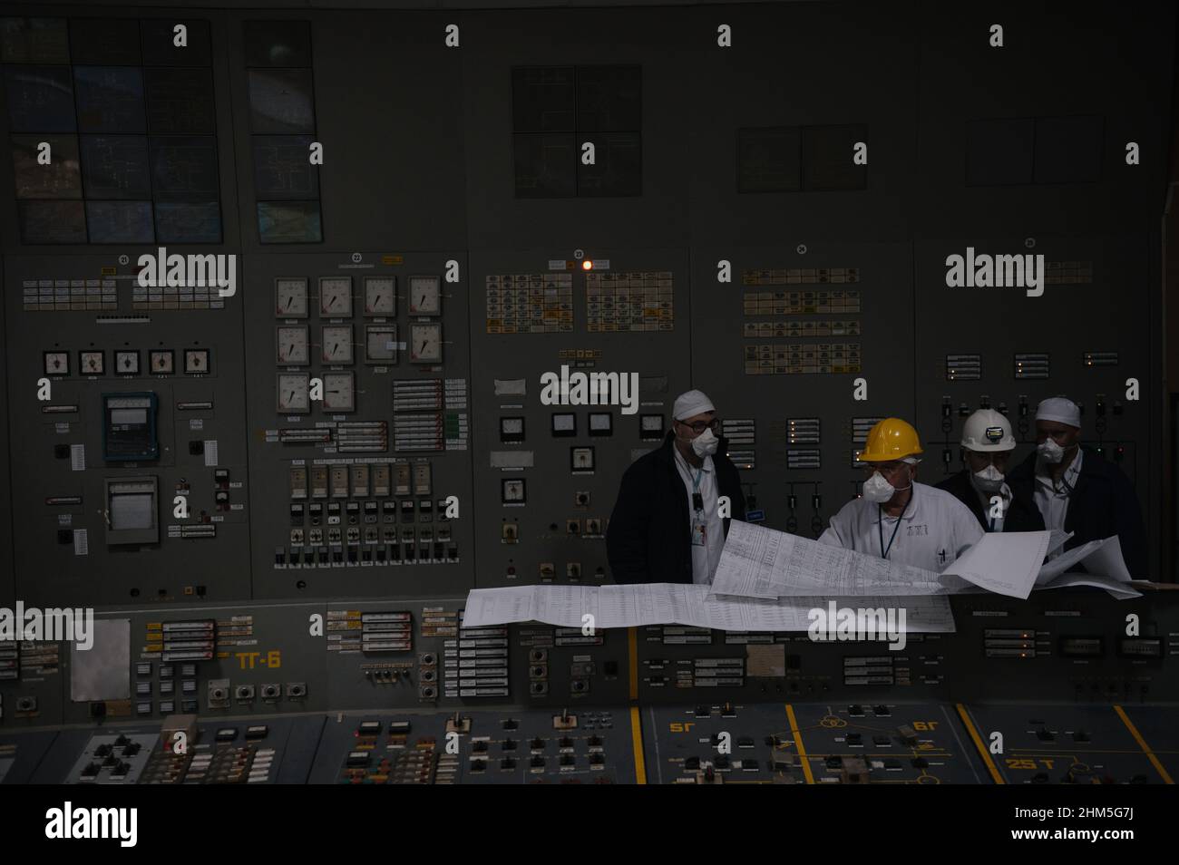 Workers decipher complex diagrams in control room 3 at the Chernobyl ...