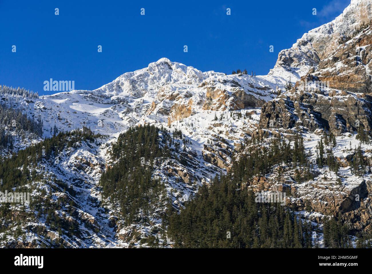 Snow capped mountain peaks along the TransCanada Highway near Field ...