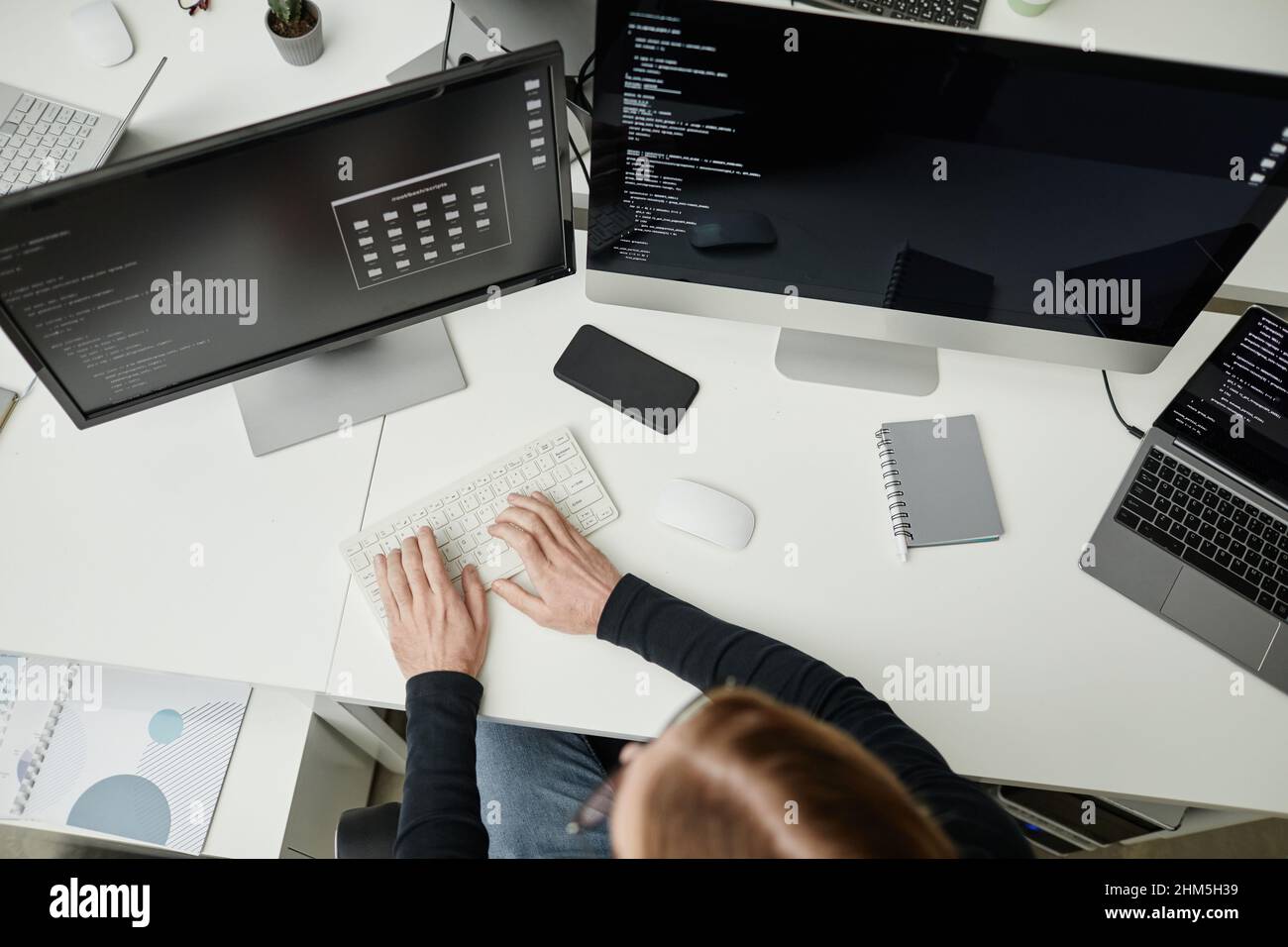 Hands of young contemporary diversity programmer working over new ...