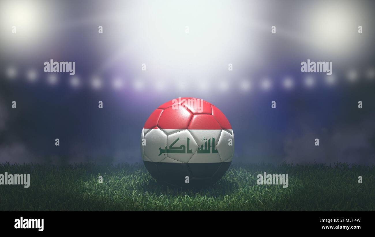 Soccer ball in flag colors on a bright blurred stadium background. Iraq ...