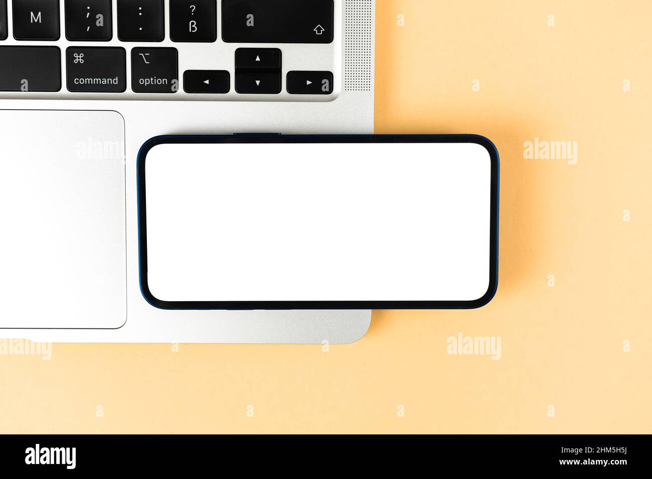 Flat lay smartphone horizontally mockup, office desktop with laptop ...