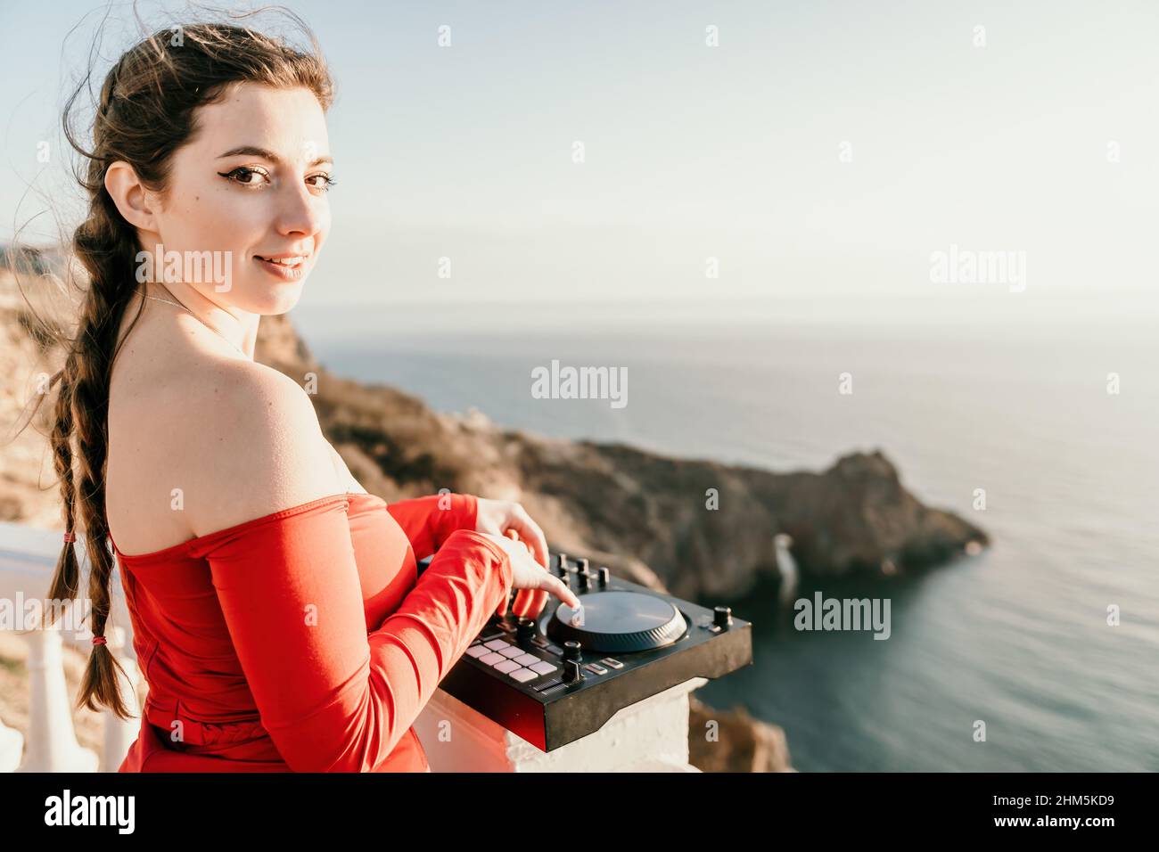 Female Hands of DJ plays music mixing and scratching on evening party ...