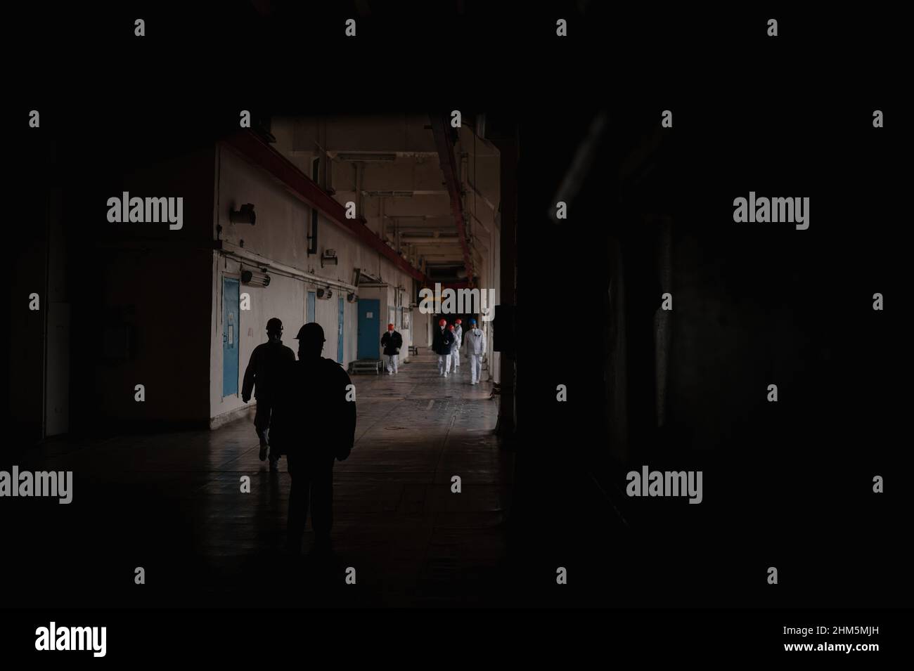 Tourists in protective clothing walk through the Chernobyl Nuclear ...