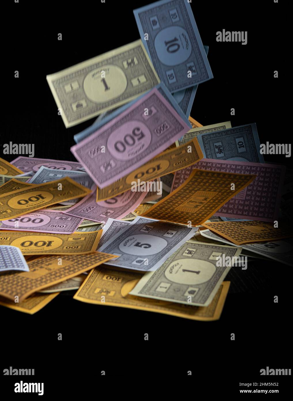 Monopoly money Falling into a pile (blurred to show movement Stock ...