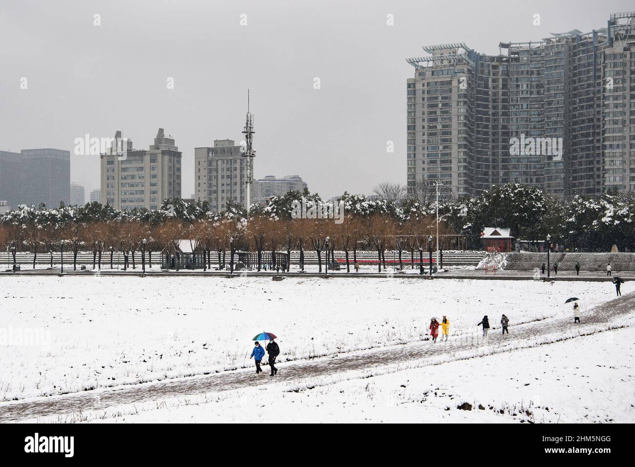 People walk in the Jiangtan park during a snowfall Hubei.Wuhan ushered ...
