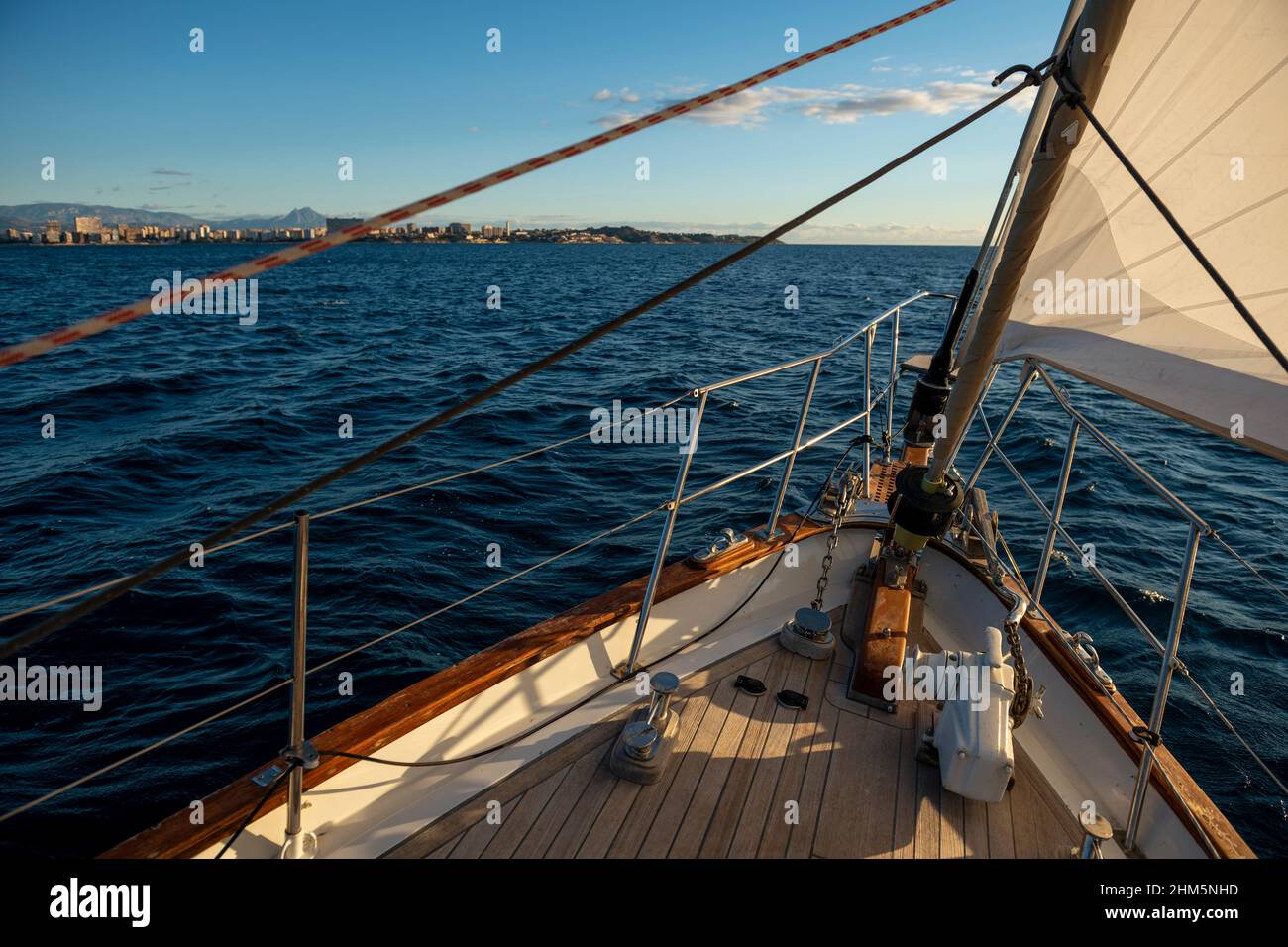 Sailing against the wind through the waves, Alicante bay, Costa Blanca ...