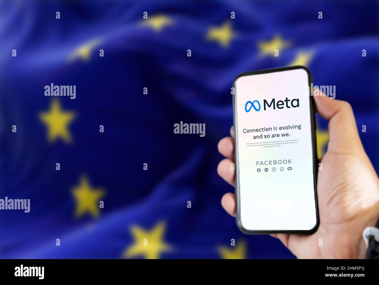 Rome, Italy, Feb 2022: hand holding a phone with the Meta mobile app on ...