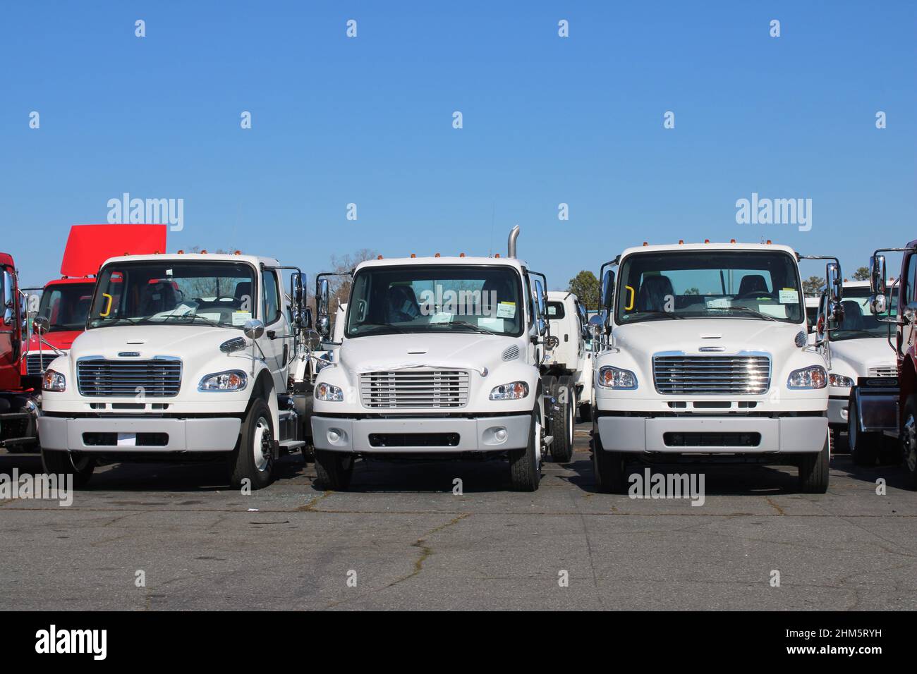 New trucks on factory lot Stock Photo - Alamy