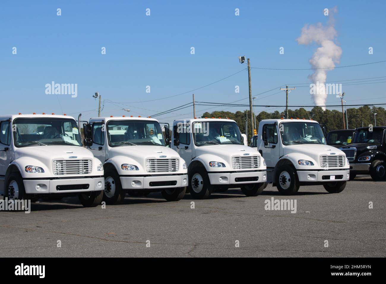 New trucks on factory lot Stock Photo - Alamy
