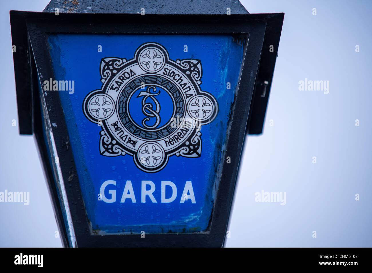 View of police emblems in Ireland, emblem on building, car, and street ...
