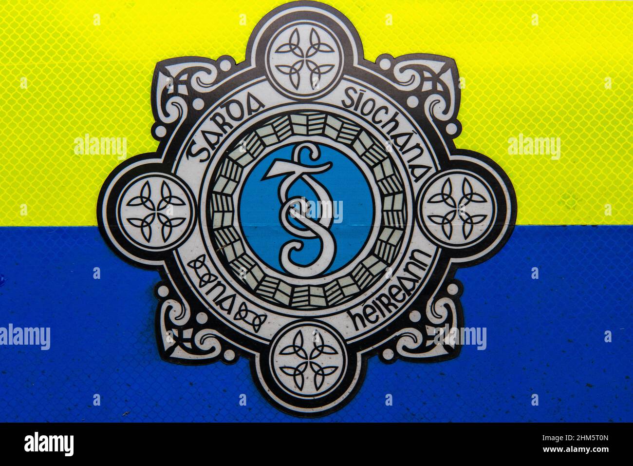 View of police emblems in Ireland, emblem on building, car, and street ...