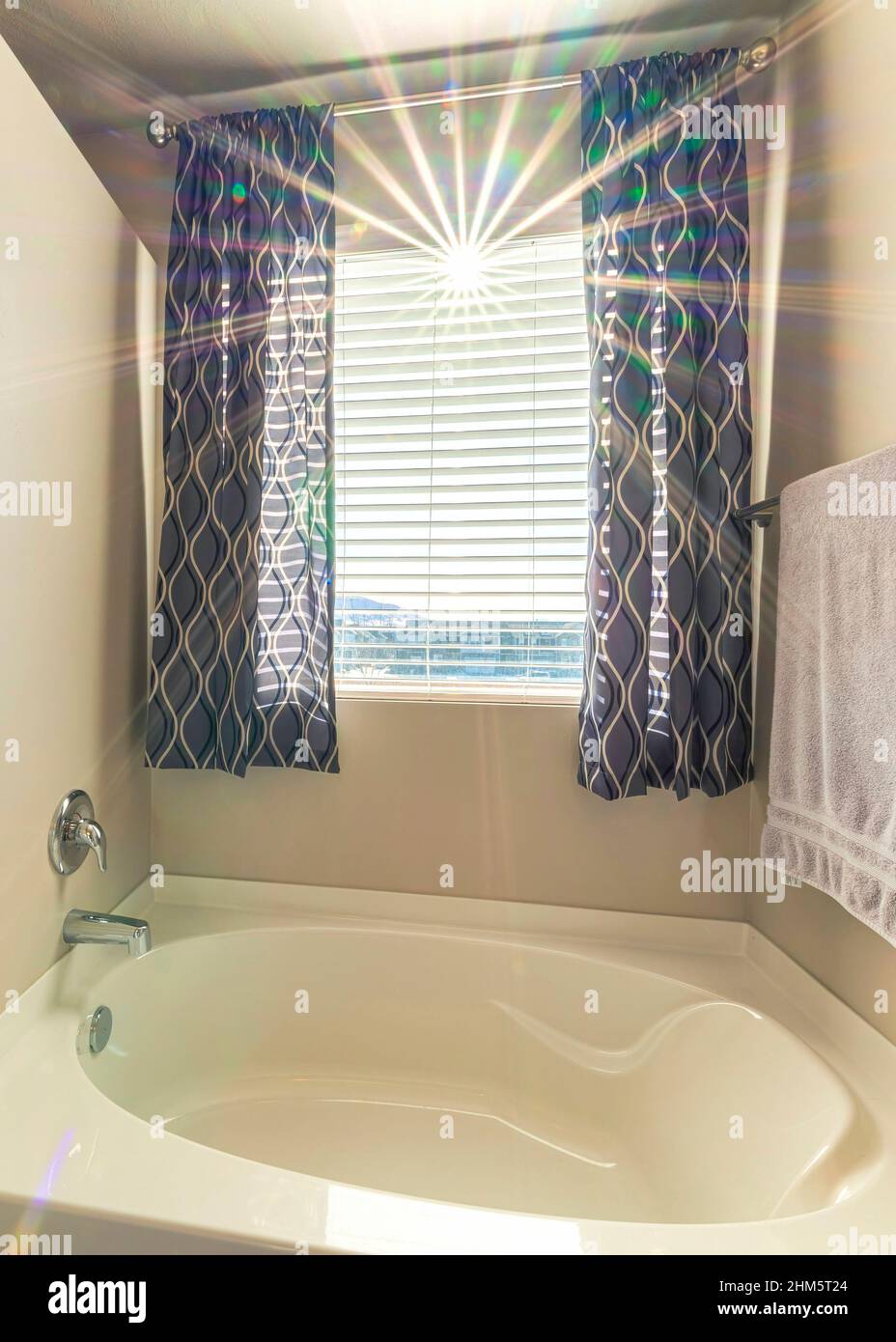 Vertical Bathroom interior with sunrays through the window blinds Stock ...