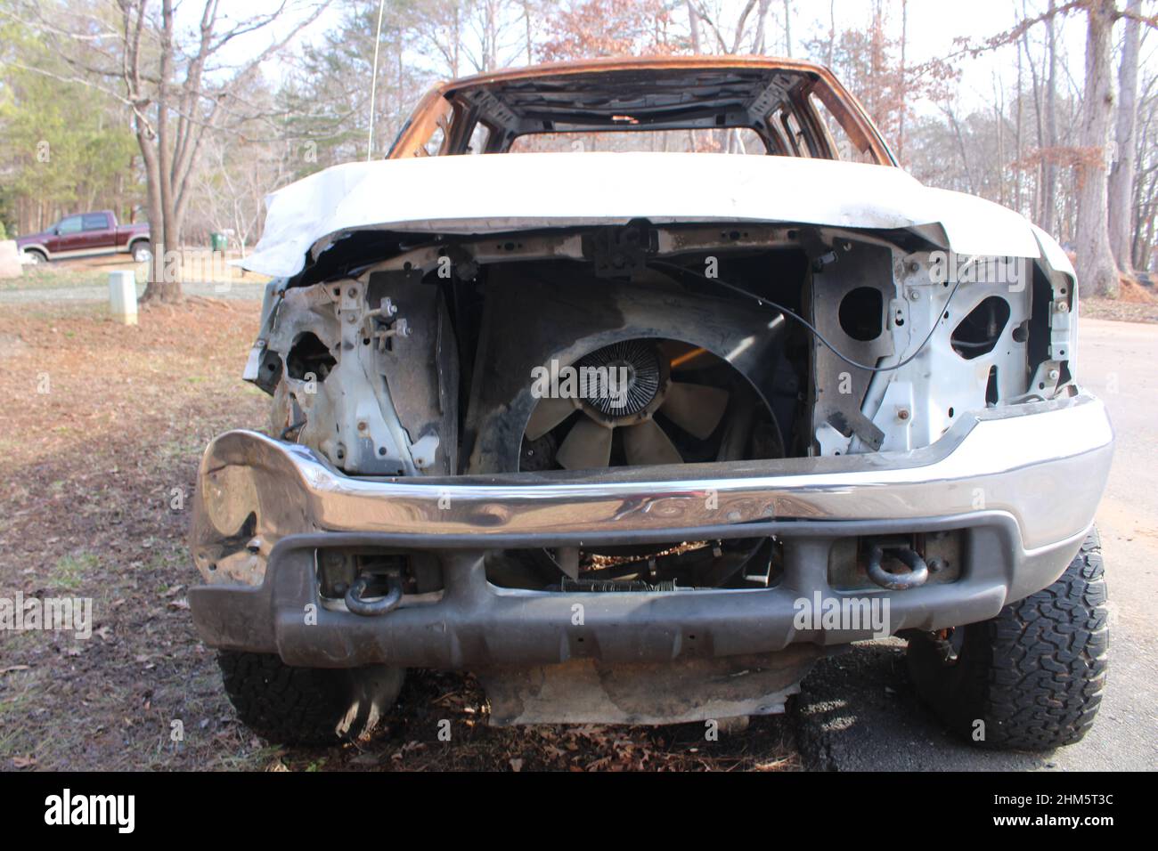 Front end of wrecked truck, with engine parts exposed Stock Photo - Alamy