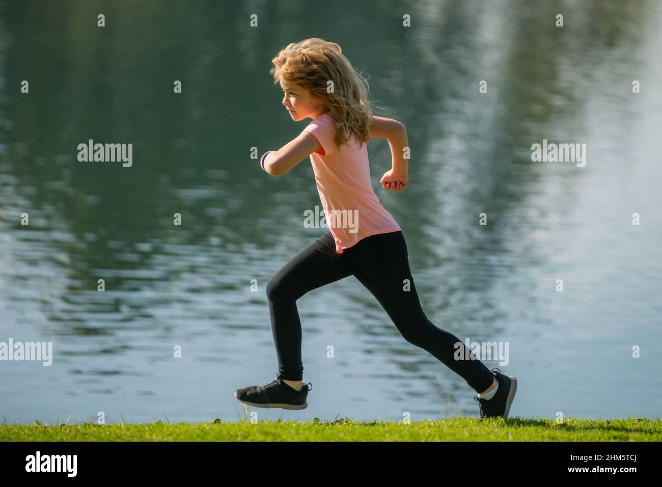 Kids jogging in park outdoor. Little boy running in nature. Active ...