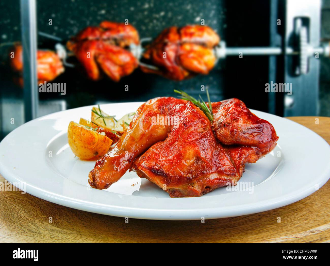 Roast chicken in machine grill hi-res stock photography and images - Alamy