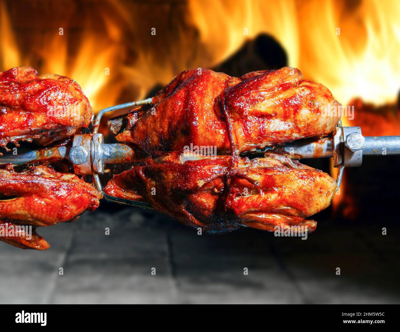 Roasted chickens in a row in a shop roaster Stock Photo - Alamy