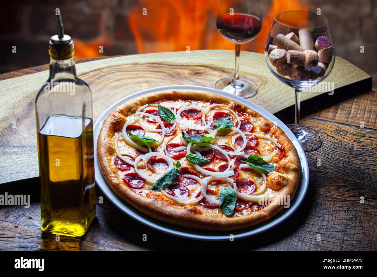 Pepperoni pizza with onion rings Stock Photo - Alamy