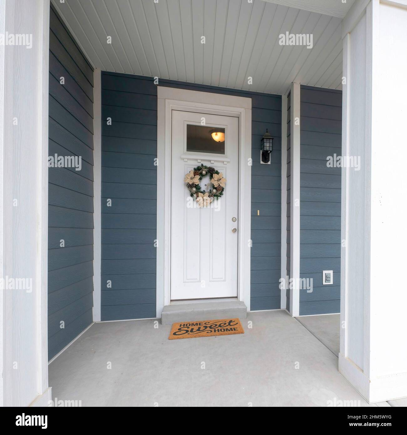 Square Exterior of a front porch of a house with gray and white tones ...