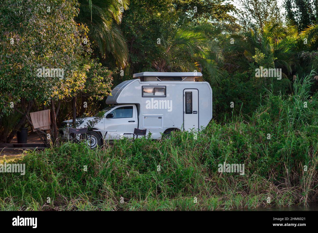 Camper van stands on the banks of the Okavango River, Namibia, Africa ...